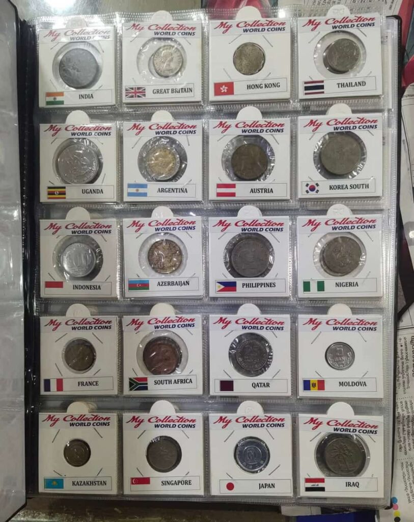 Collectible album of 100 different foreign coins - coinsstuff